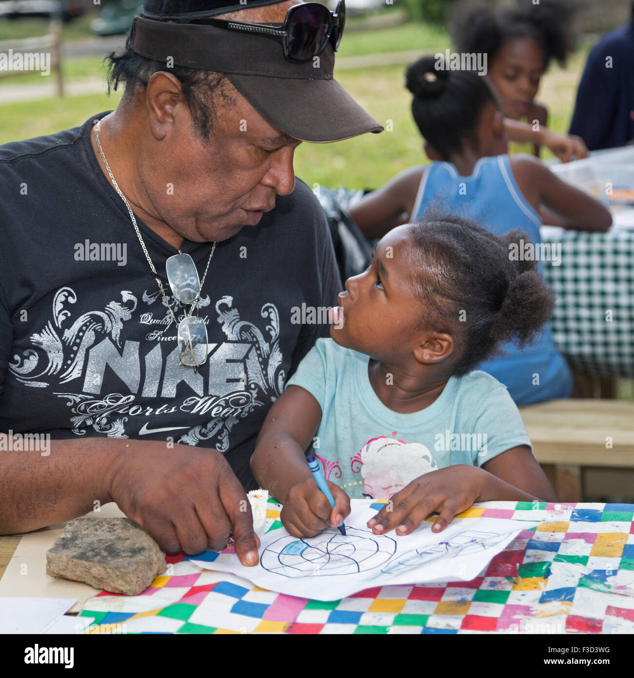Detroit, Michigan - Children work on an art project in a park created ...