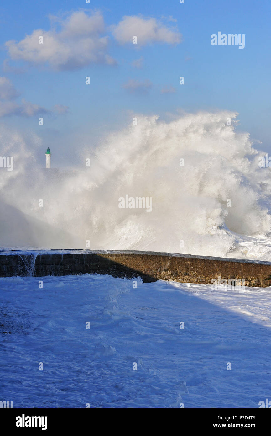 Giant wave crashing over jetty during storm along the North Sea coast ...
