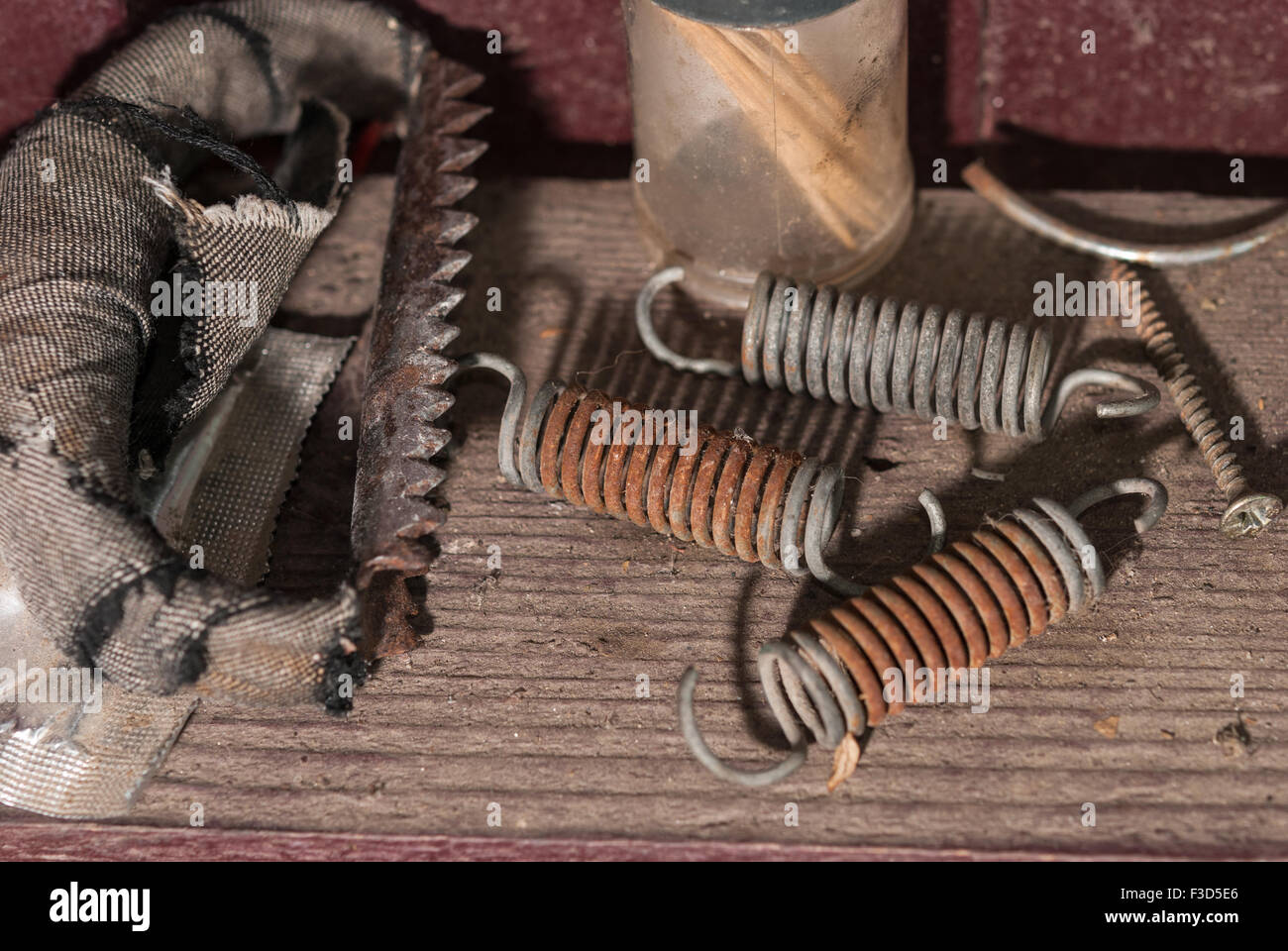 Rusty tools on the old untidy wooden workbench closeup Stock Photo - Alamy