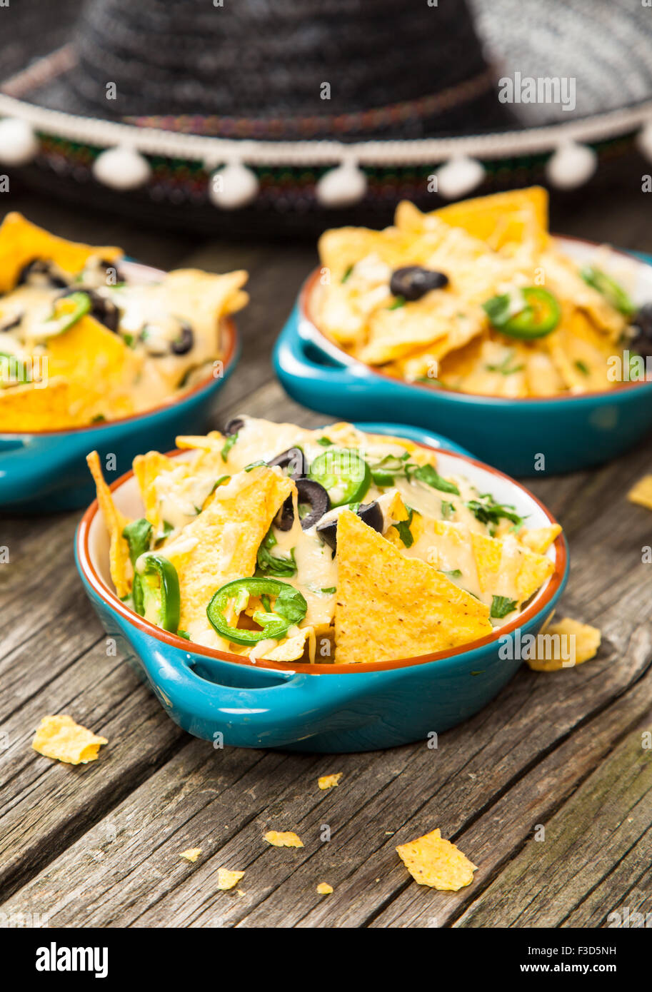 Nachos with melted cheese Stock Photo - Alamy