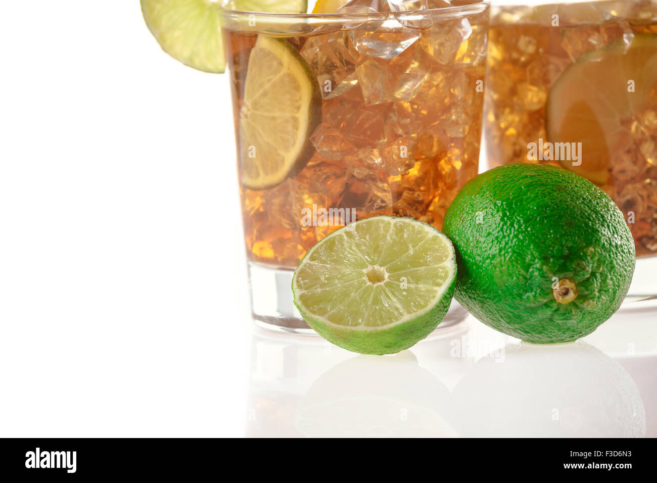 Fresh Fresh cocktail with cola drink and lime fruit on white background ...