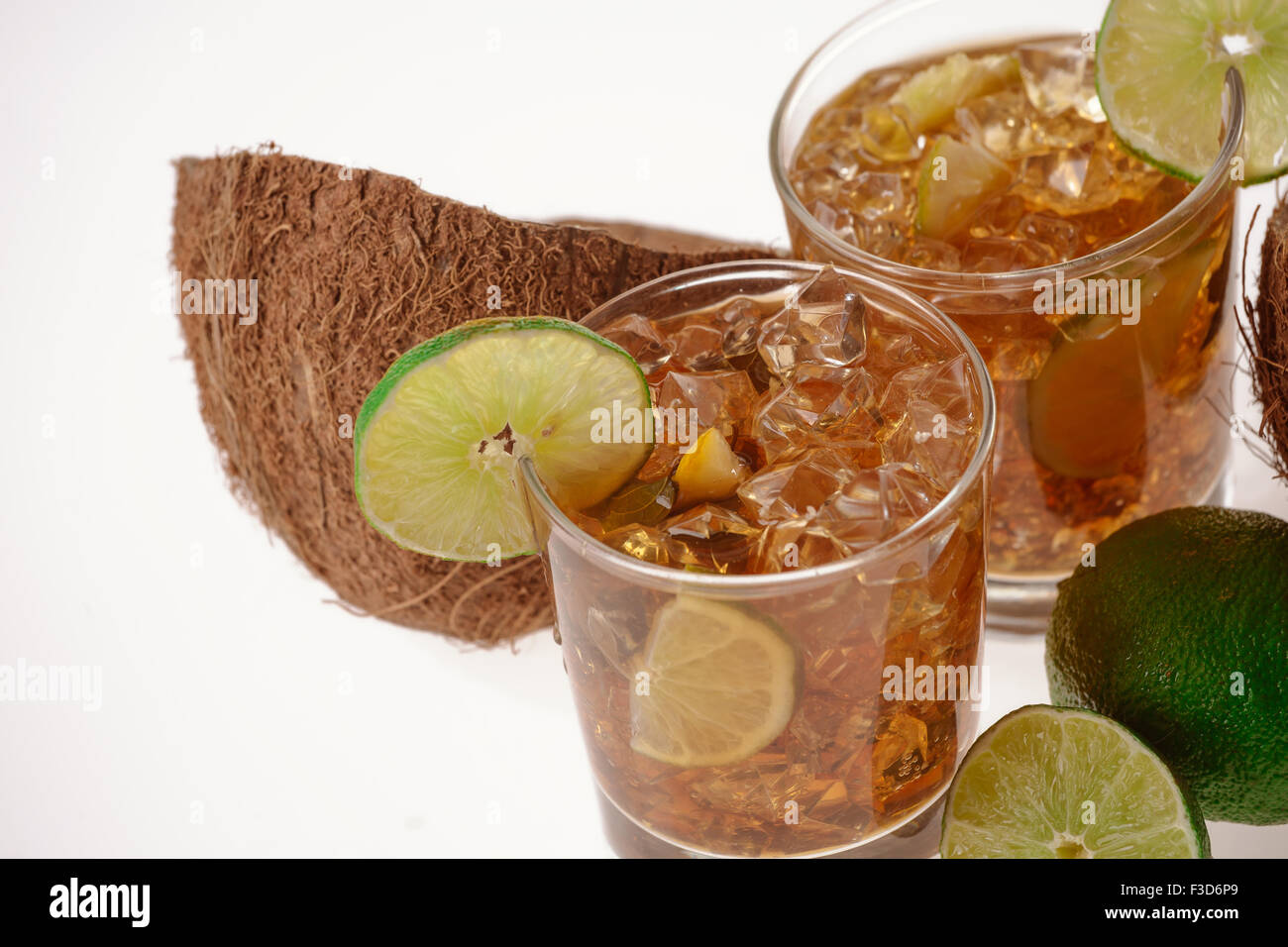 Fresh Fresh cocktail with cola drink coconut and lime fruit on white ...