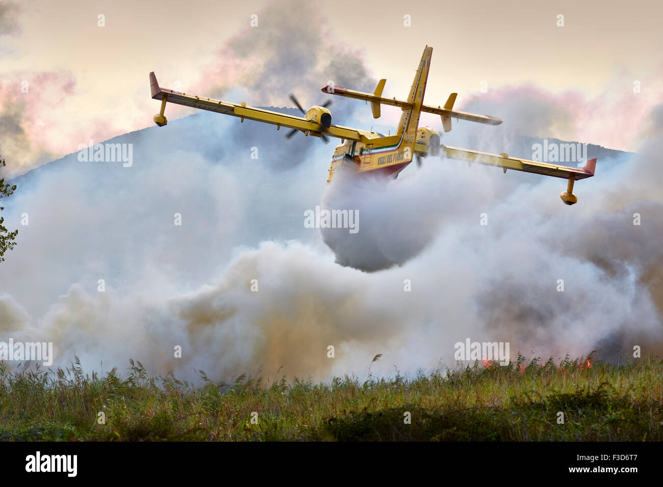 Firefighting aircraft dousing forest fire over Sardinia Stock Photo - Alamy