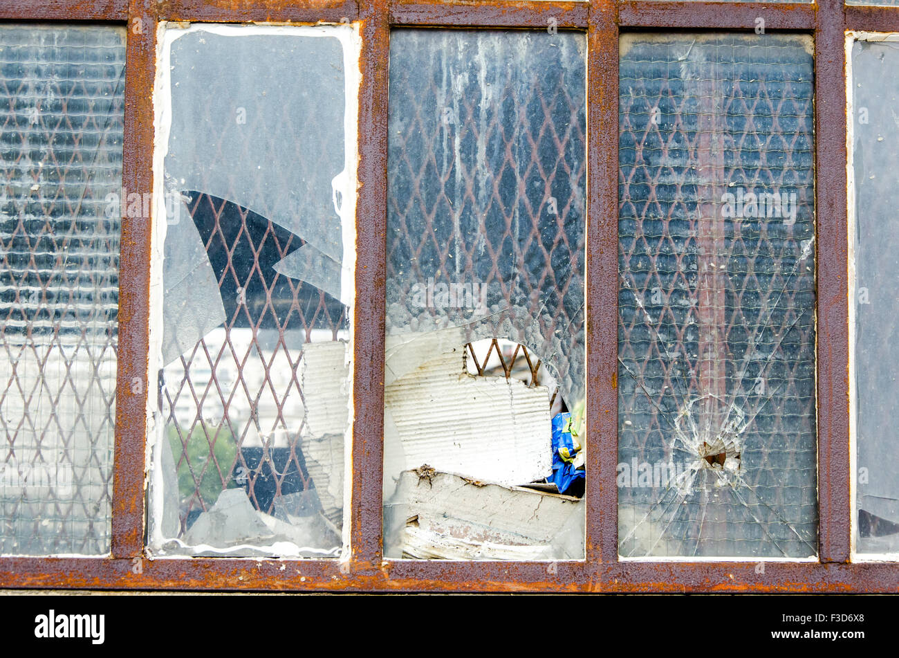Rusty and broken window on an urban background Stock Photo - Alamy