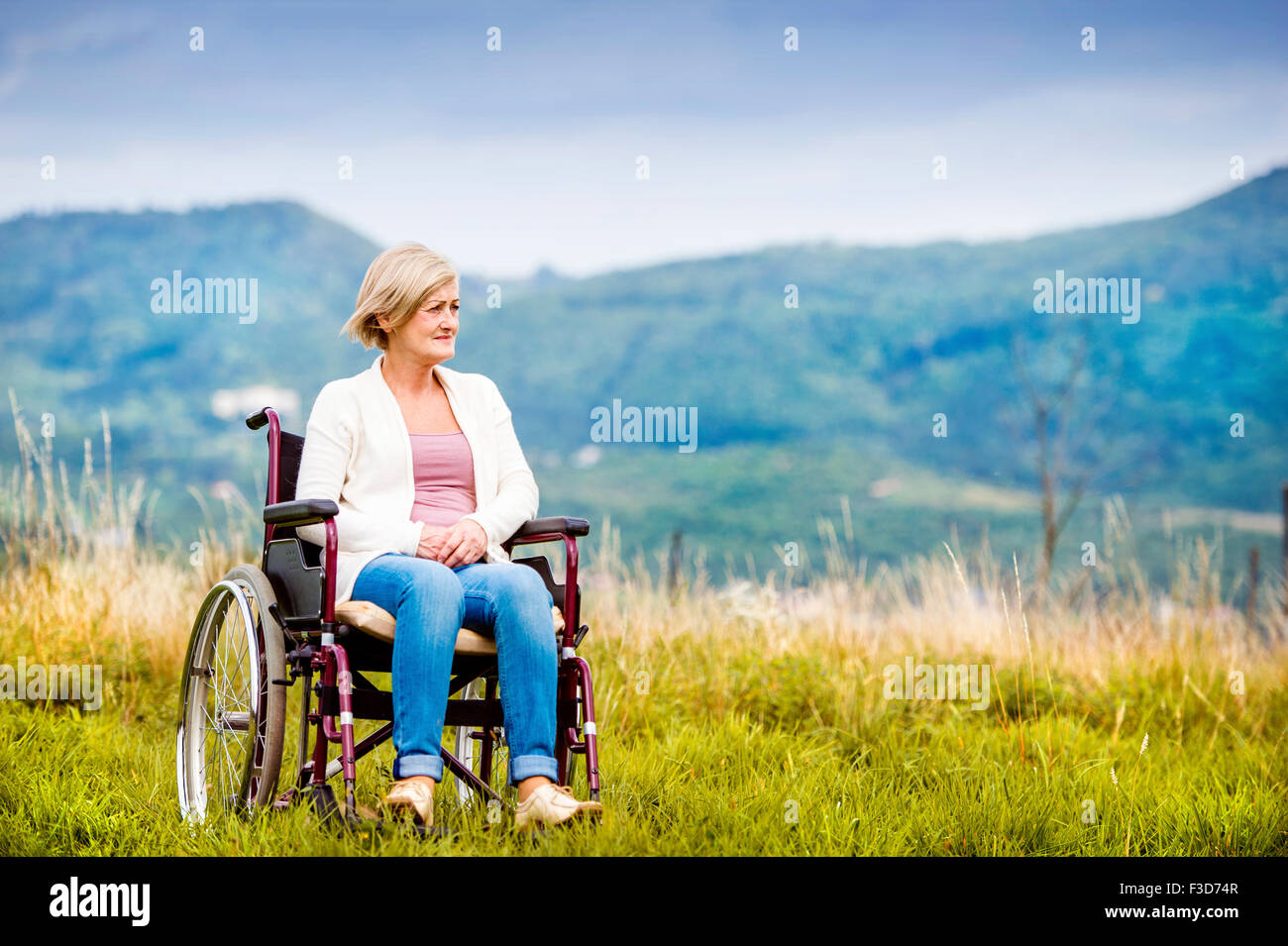 Woman in wheelchair Stock Photo - Alamy