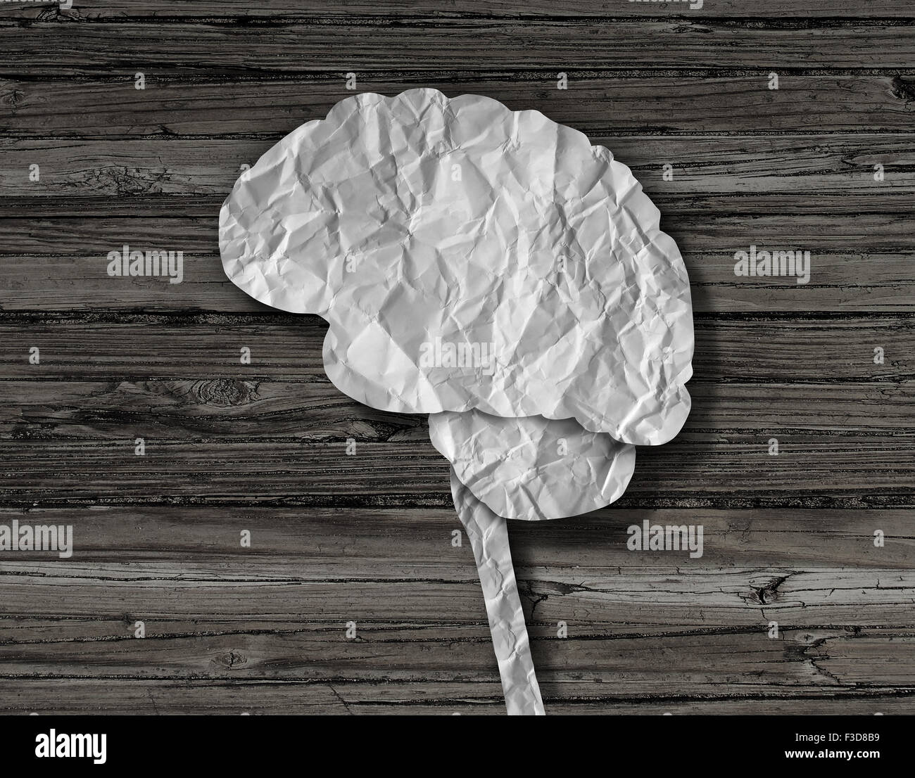 Brain paper medical concept as a crumpled sheet cut into the shape of a ...