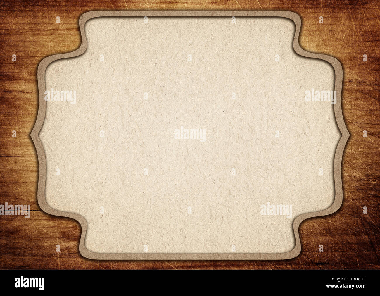 Brown ornate paper frame on old scratched cutting board Stock Photo - Alamy