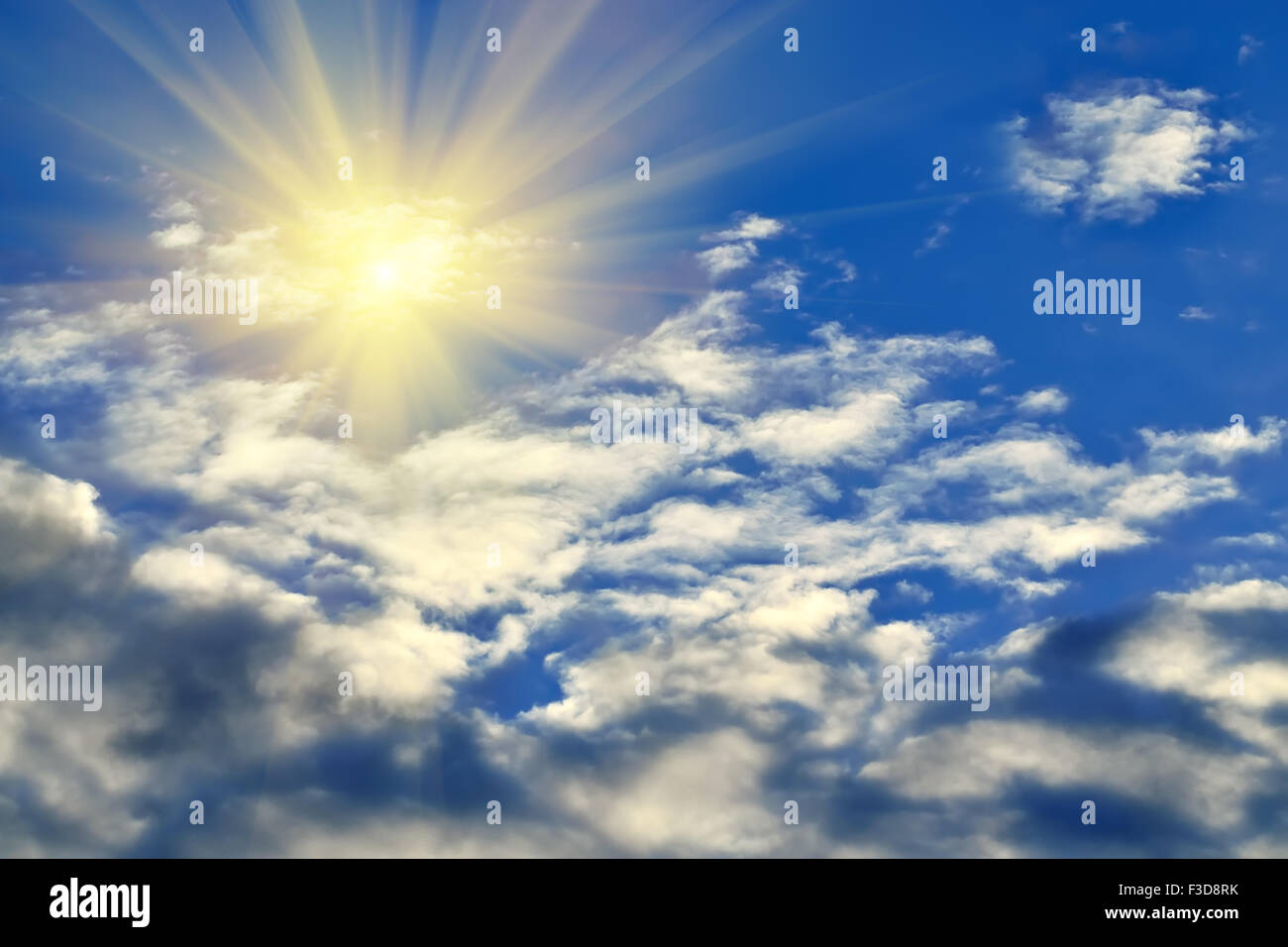 The sun and Cumulus clouds Stock Photo - Alamy