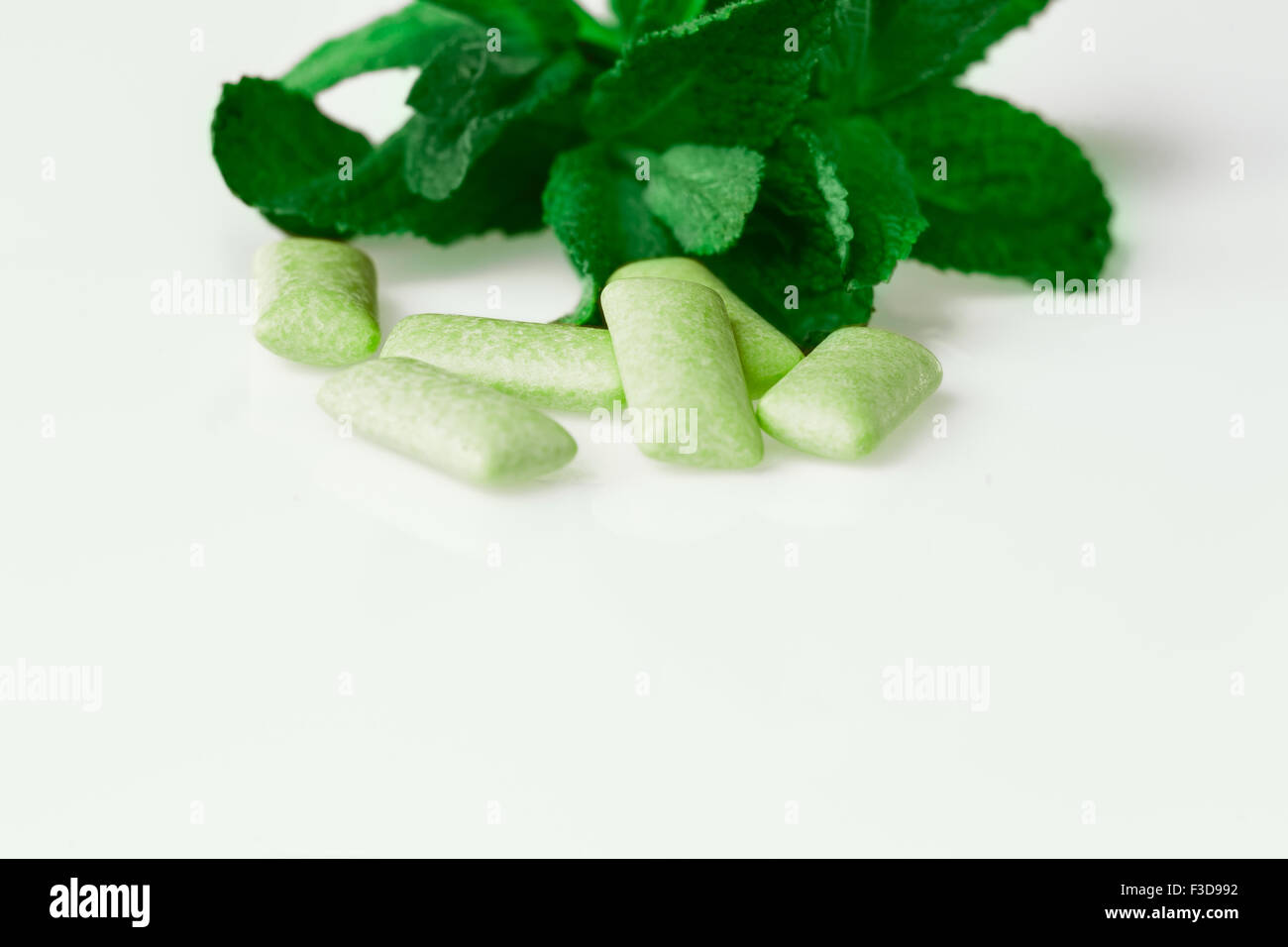 green chewing gum on white - food and drink Stock Photo - Alamy