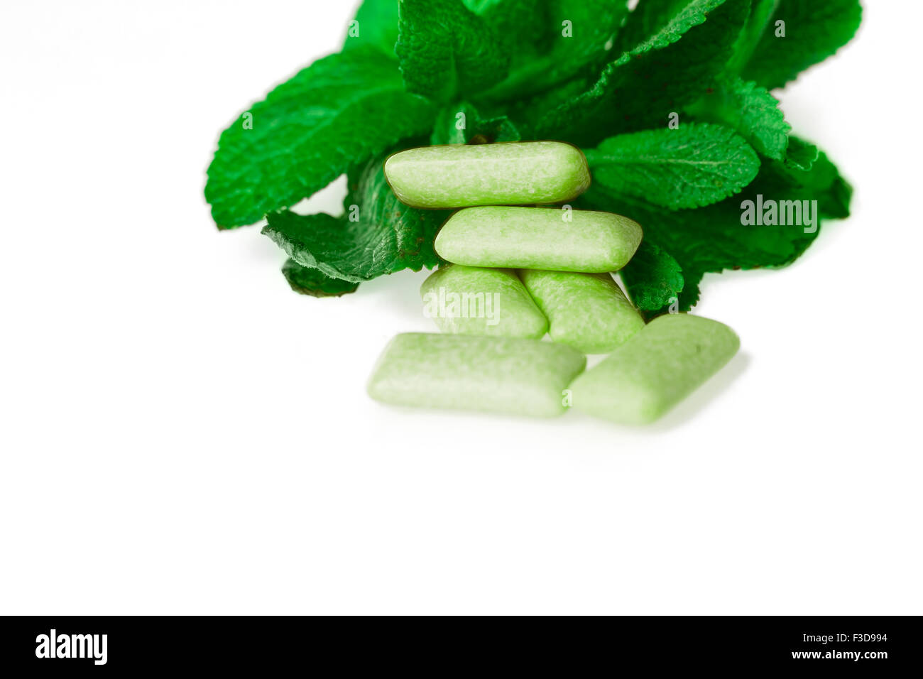 green chewing gum on white - food and drink Stock Photo - Alamy