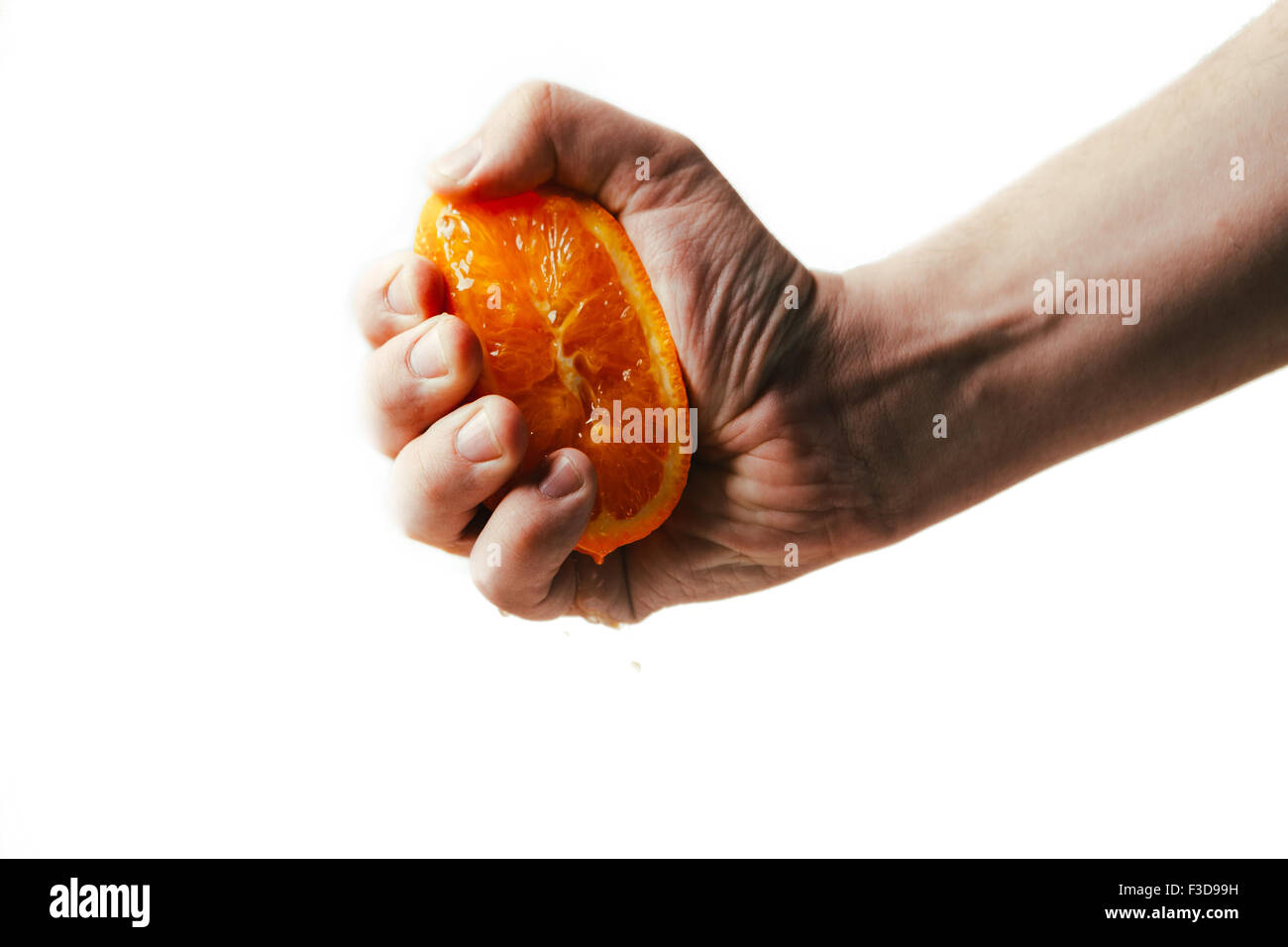 man dramatic squeezes orange. Concept squeezed a man is tired from work ...