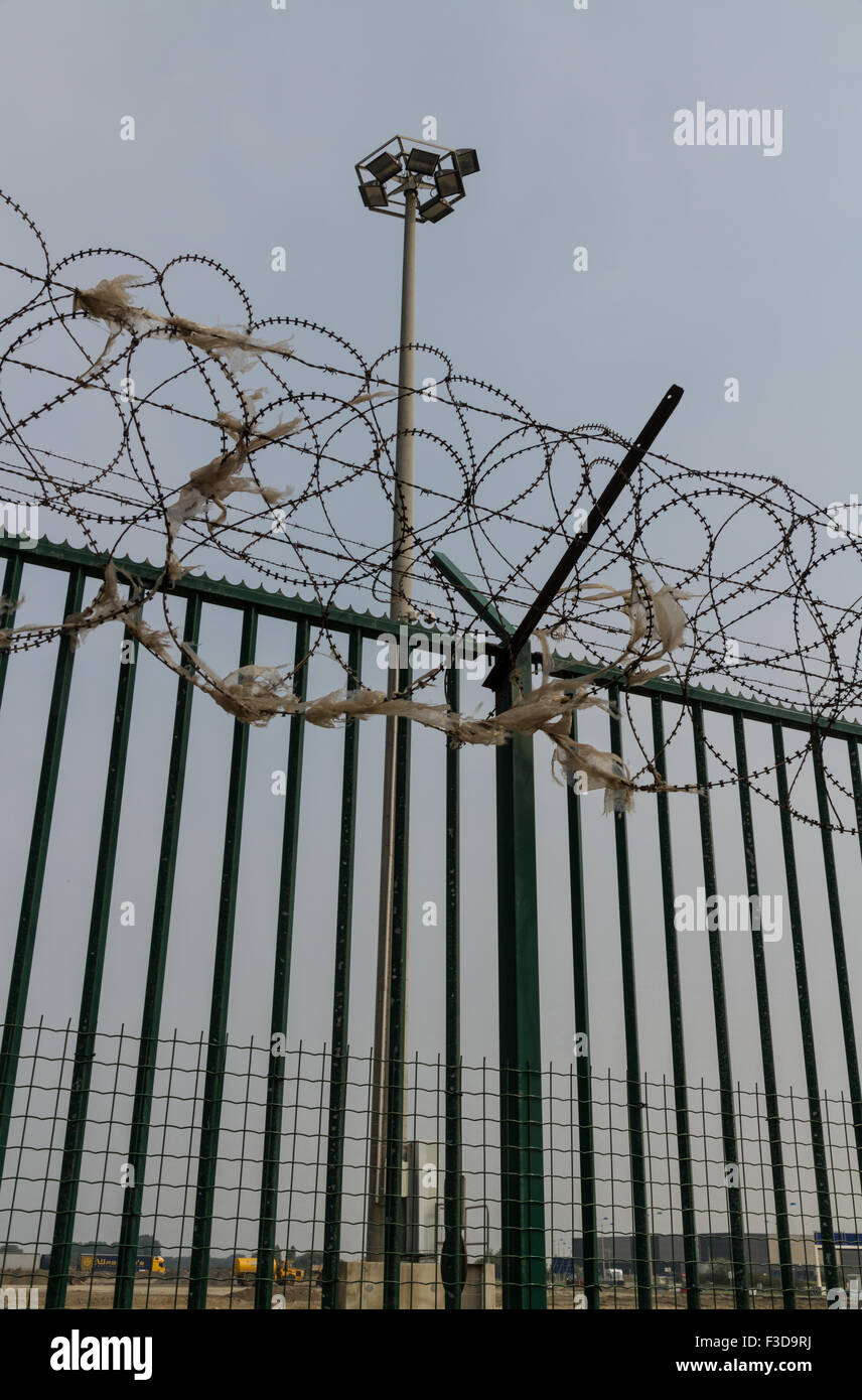 Boundary area of ferry terminal. Fence and Razor wire to deter refugees ...