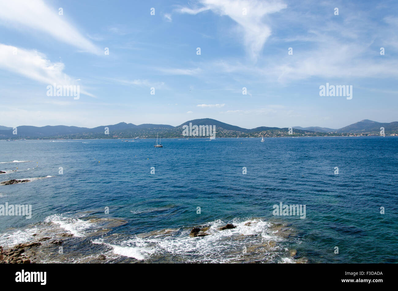 Beautiful blue sea, blue sky, mountain, sailing boats Stock Photo - Alamy