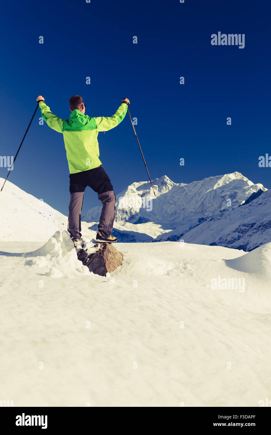 Man hiker or climber accomplish in winter mountains, inspiration and ...