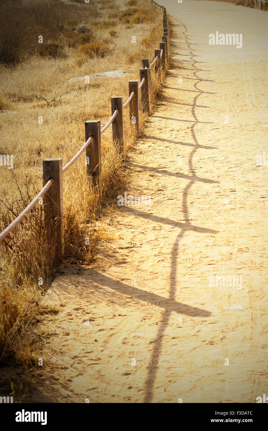 earth path in a natual park leading to the beach Stock Photo - Alamy