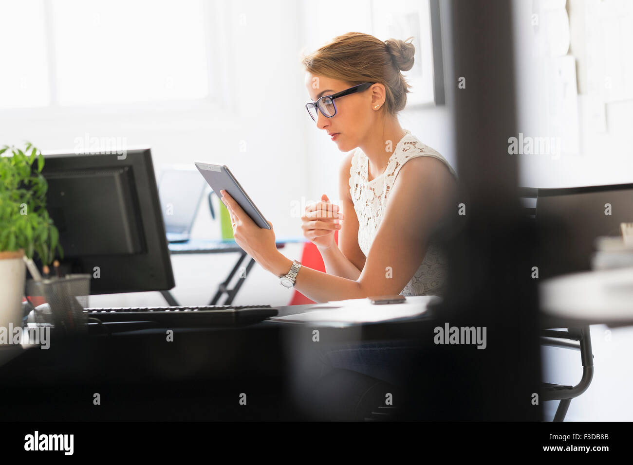 Young woman working in office Stock Photo - Alamy