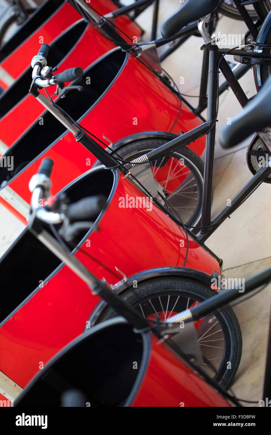Stylish delivery tricycles parked on a square Stock Photo - Alamy
