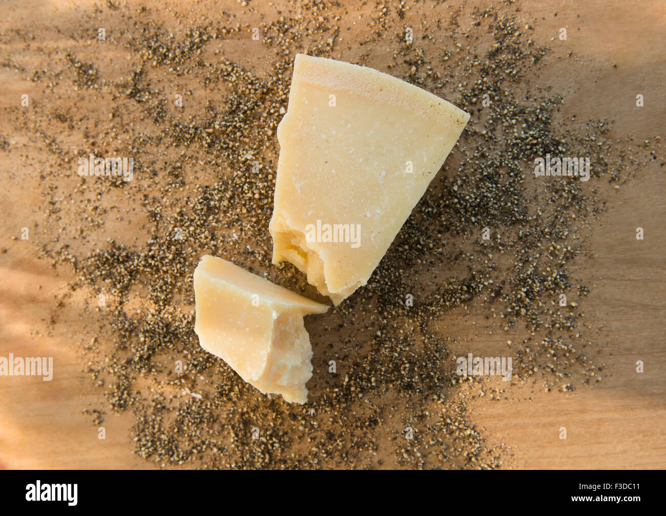 Studio shot of parmesan cheese on dried herbs Stock Photo - Alamy