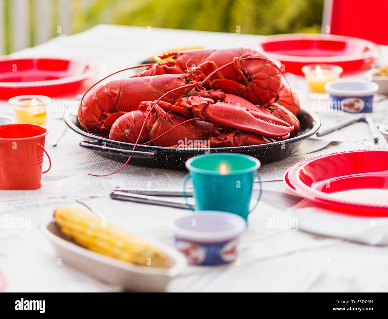 Plate with lobsters on dining table Stock Photo - Alamy