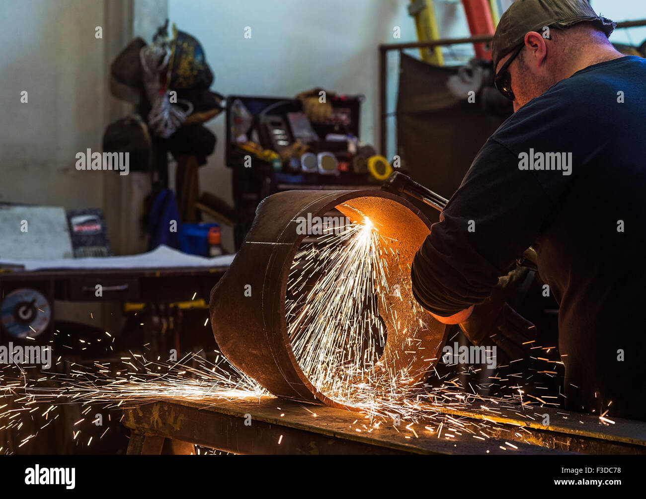 Welder working in metal workshop Stock Photo - Alamy