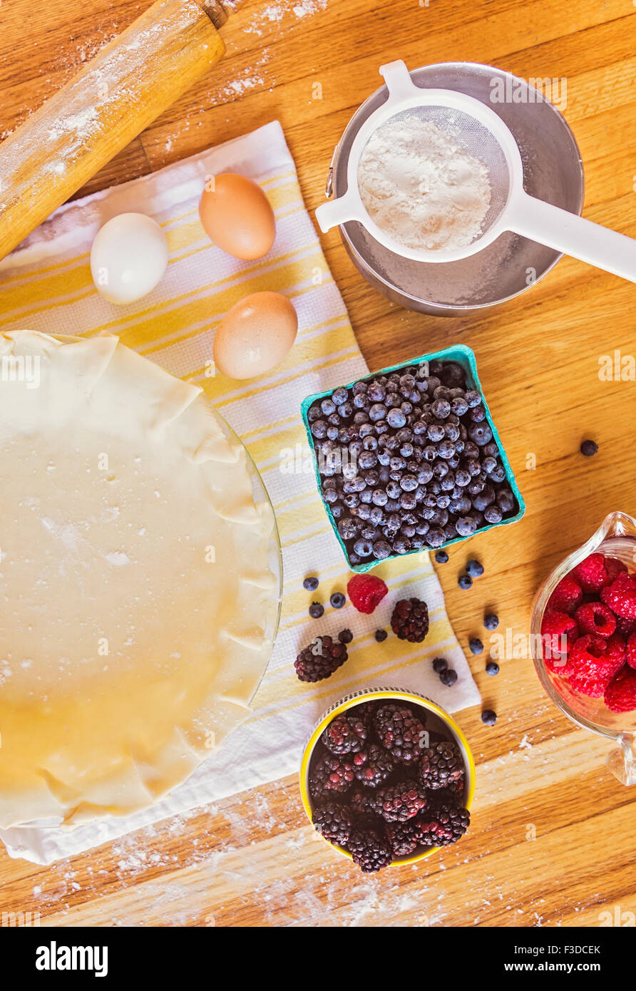 Ingredients for berry pie on table Stock Photo - Alamy