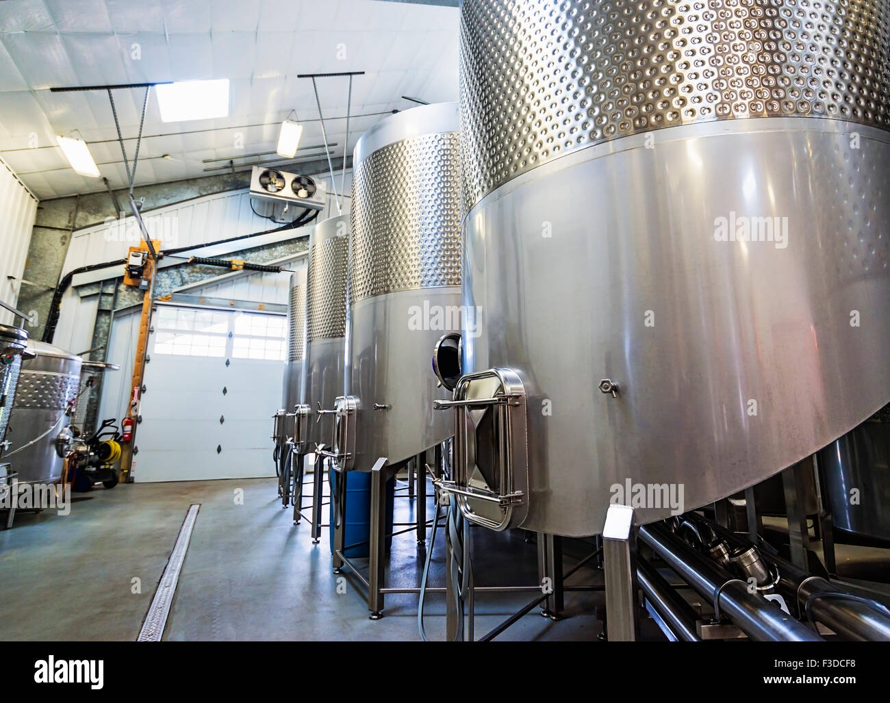 Stainless steel tanks in winery cellar Stock Photo - Alamy