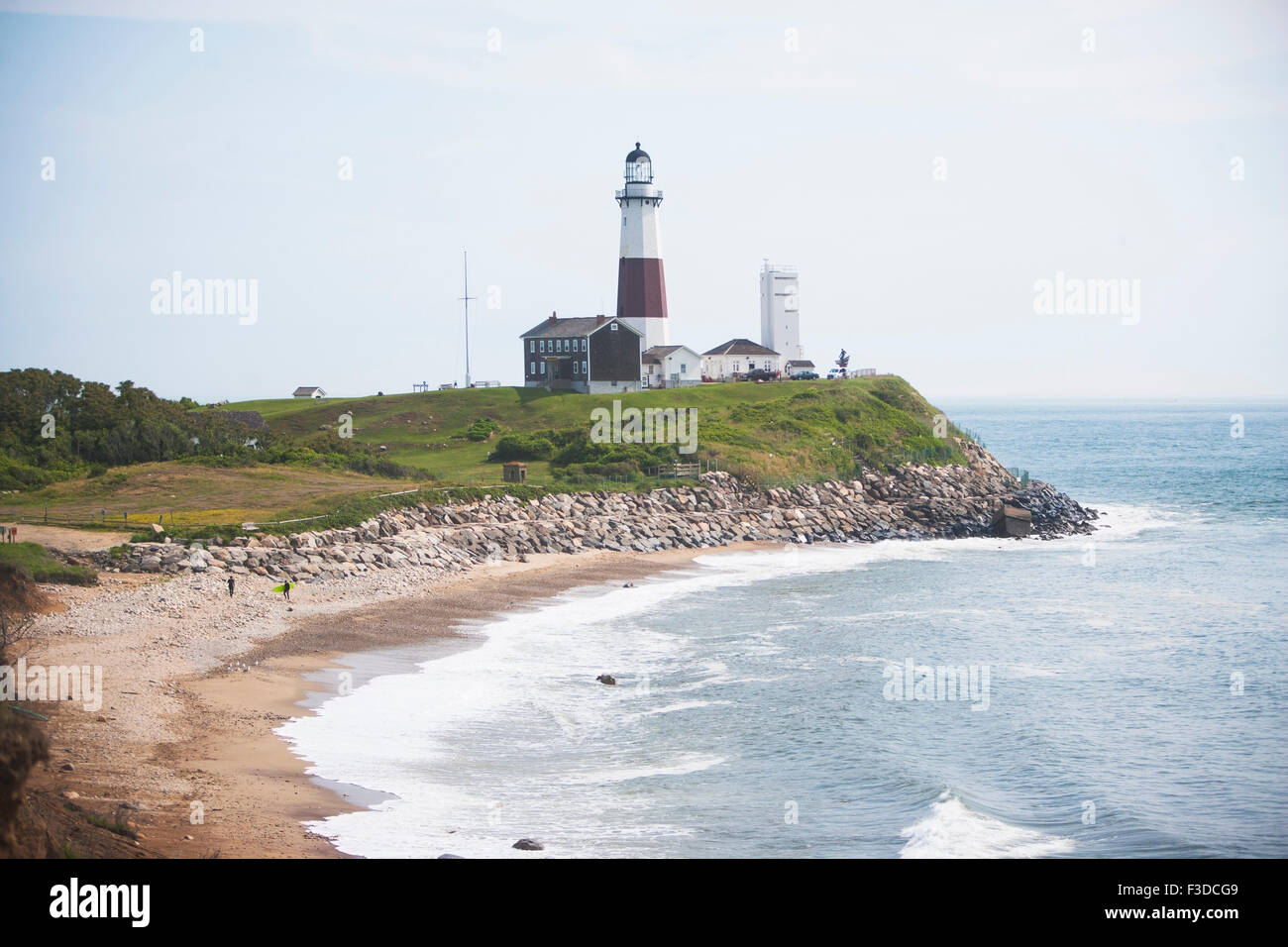 Lighthouse on cliff over sea Stock Photo - Alamy