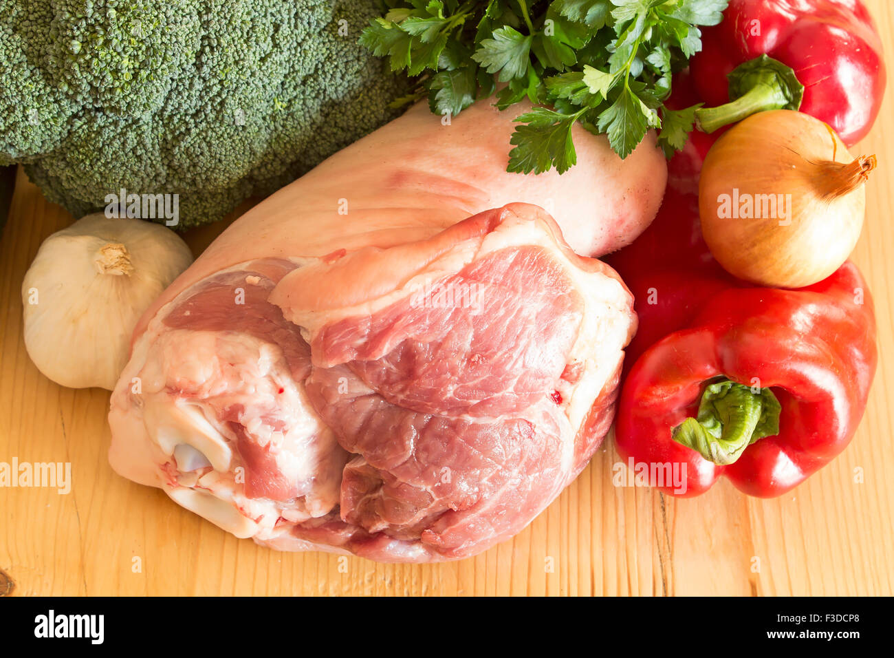 Pork knuckle and vegetables on the plank table Stock Photo - Alamy