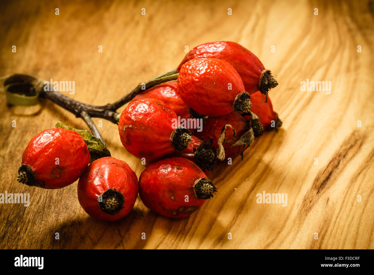 Hawthorn on wooden rustic table background. Rose hips haw fruit of the ...