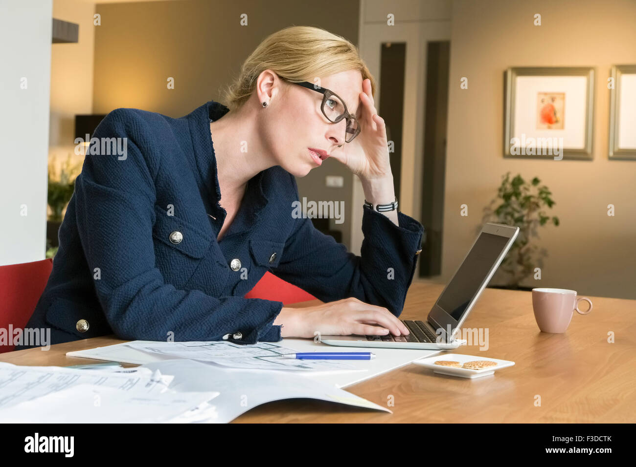 Woman jacket desk hi-res stock photography and images - Alamy