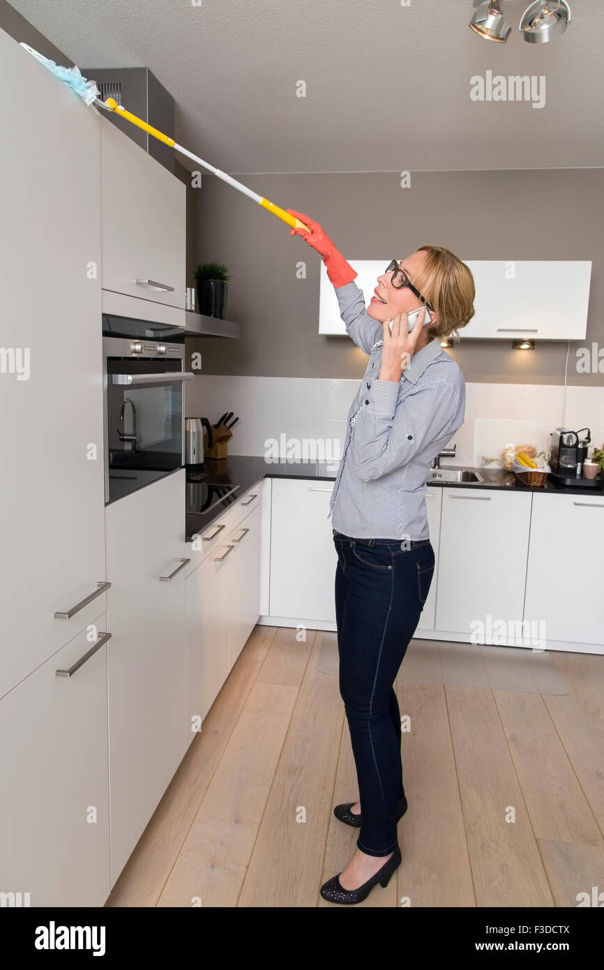 Woman cleaning house Stock Photo - Alamy