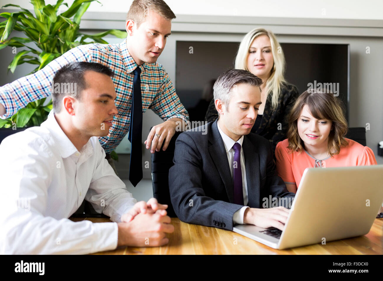 Man showing presentation on laptop Stock Photo - Alamy
