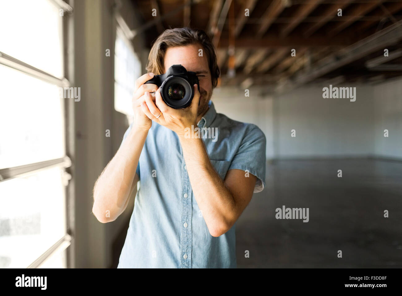 Portrait of man with digital camera Stock Photo - Alamy