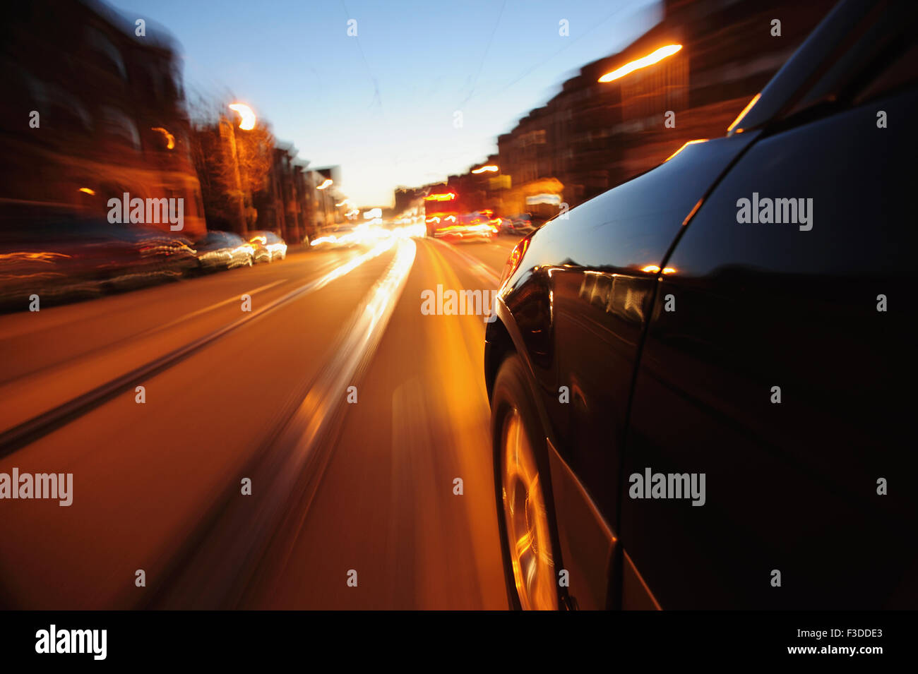 Car driving through city hi-res stock photography and images - Alamy