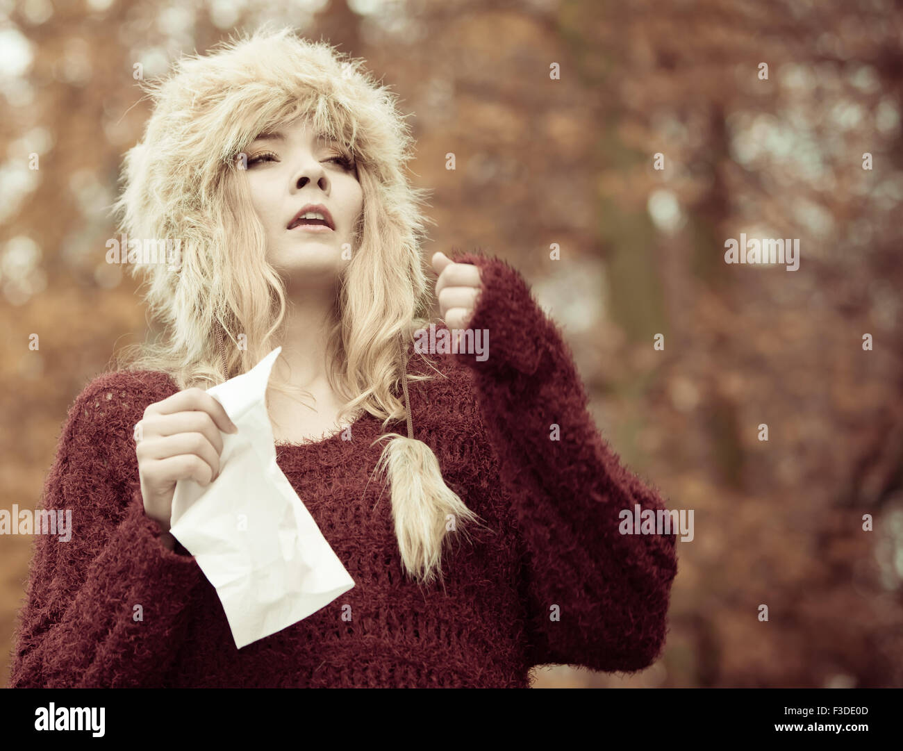 Flu cold, allergy symptom or other virus. Sick woman walking outdoor ...