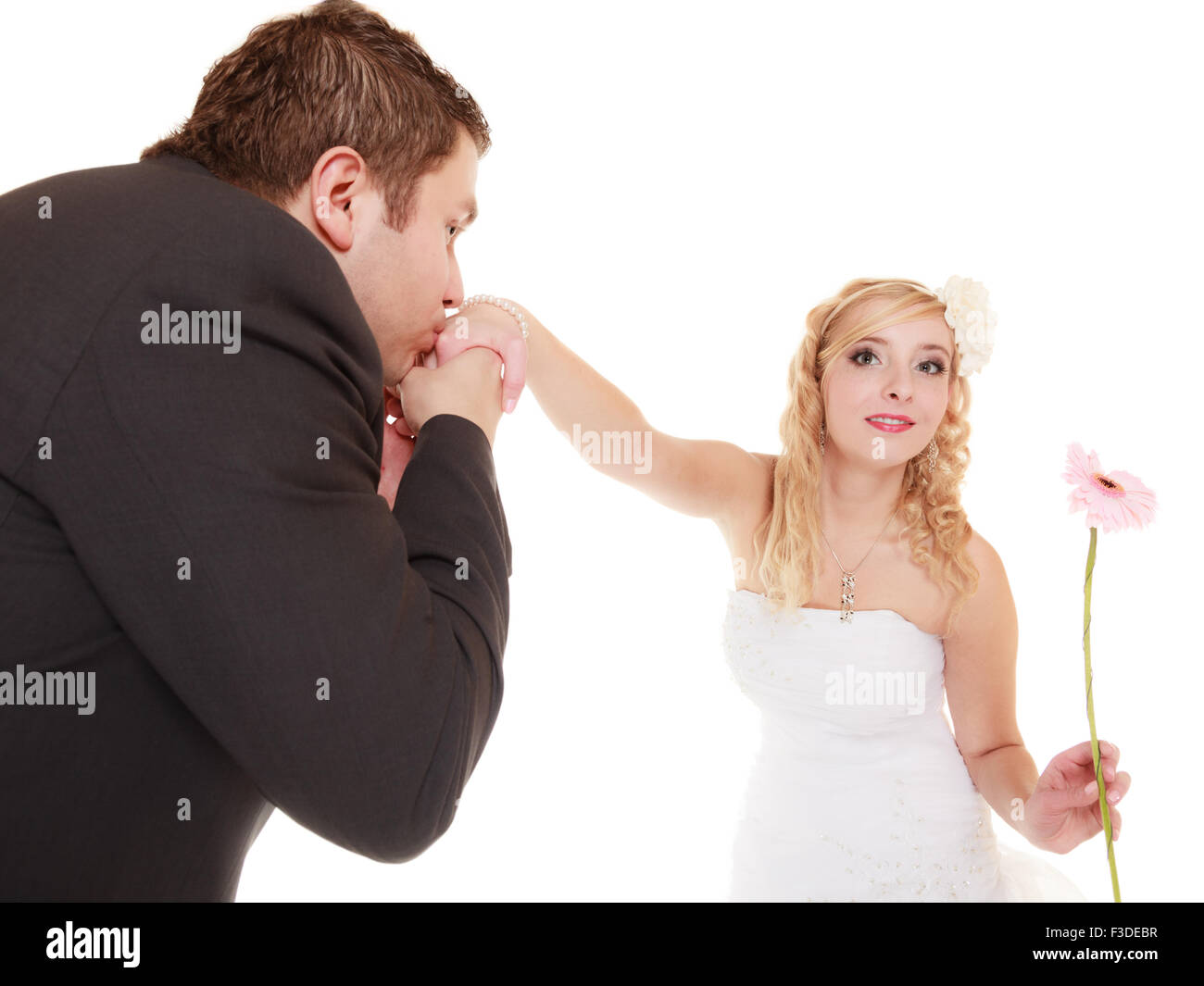 Wedding day. Male groom kissing hand of female bride isolated on white ...
