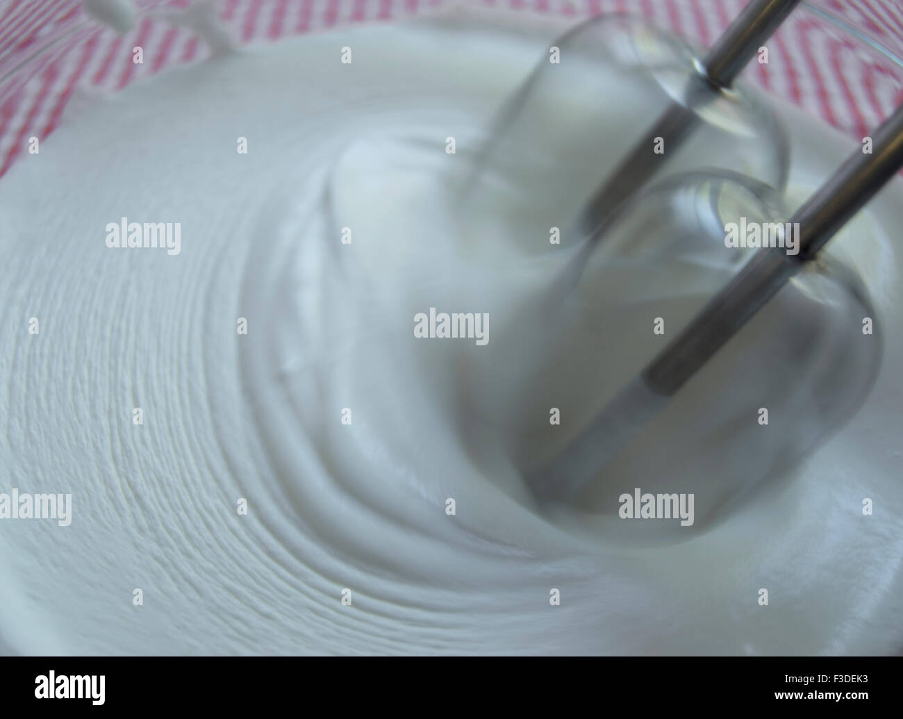 Whipped cream being blended Stock Photo - Alamy