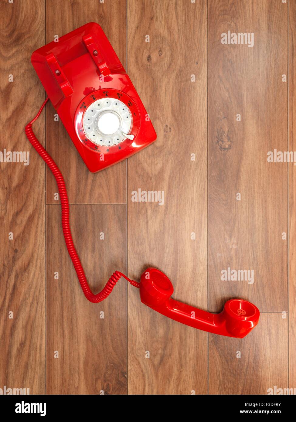 A close up photo of a red rotary phone Stock Photo - Alamy
