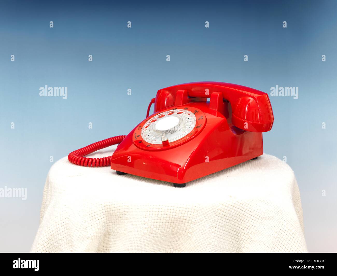 A close up photo of a red rotary phone Stock Photo - Alamy