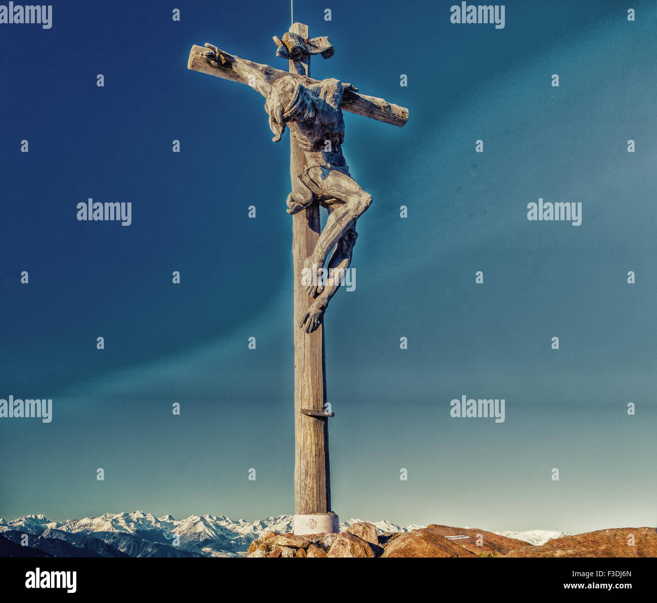 A wood carved statue of the Crucifixion of Jesus Christ on top of the ...