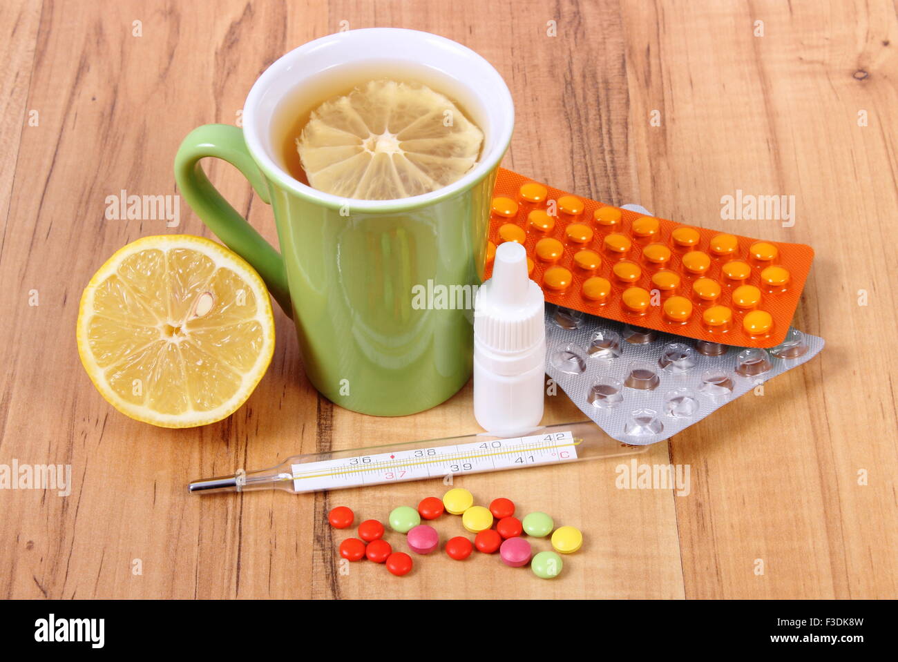 Pills, nose drops and hot tea with lemon for colds, treatment of colds ...