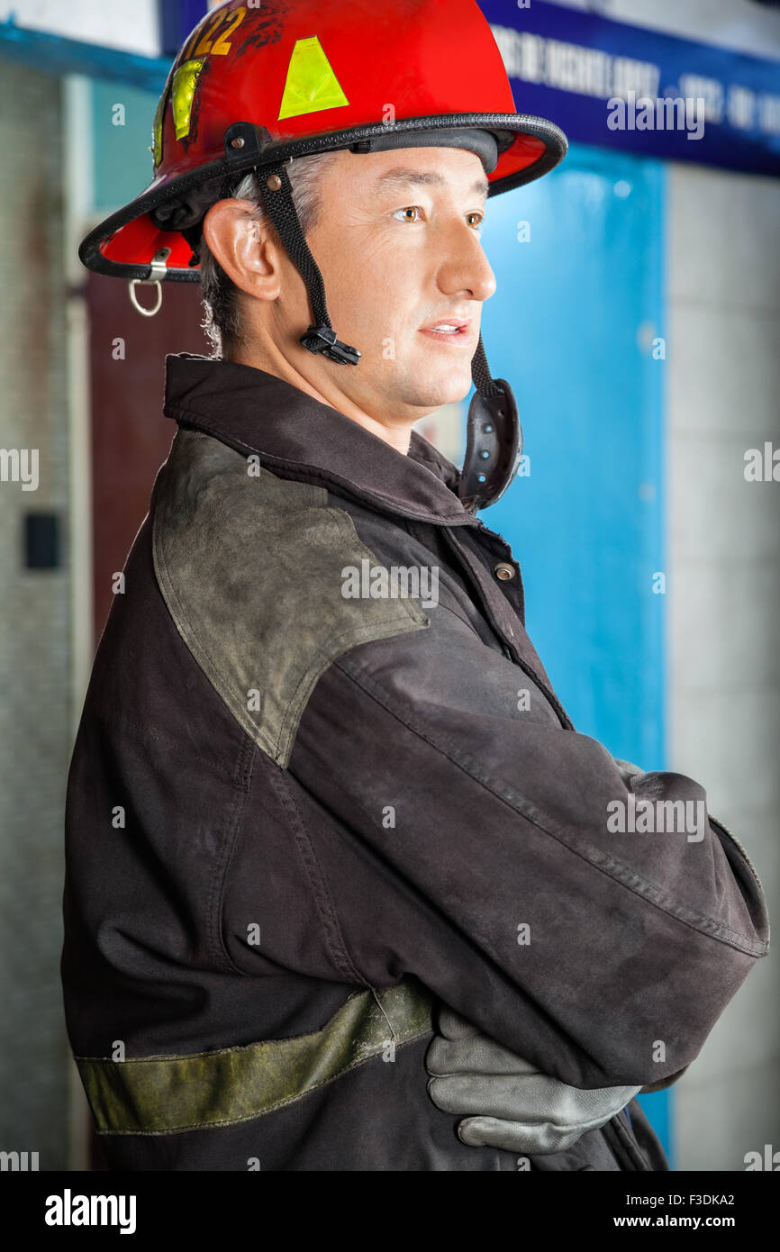 Side View Of Confident Firefighter At Fire Station Stock Photo - Alamy