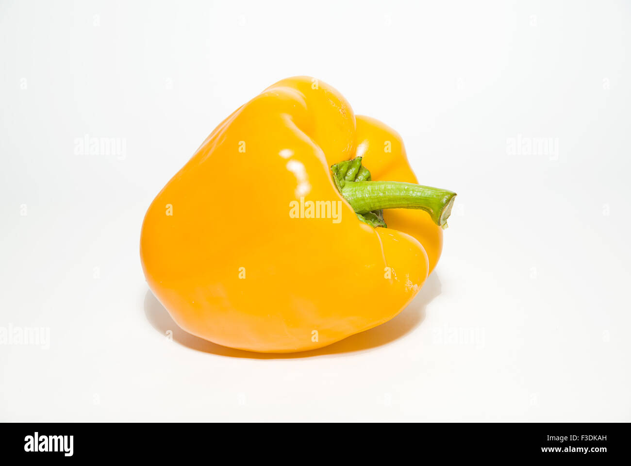 One yellow pepper on a white background Stock Photo - Alamy