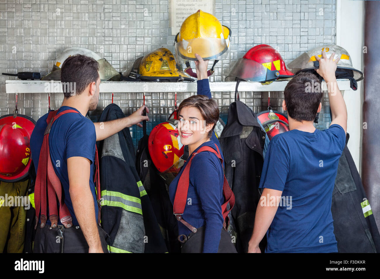 Firefighters Getting Ready In Fire Station Stock Photo - Alamy