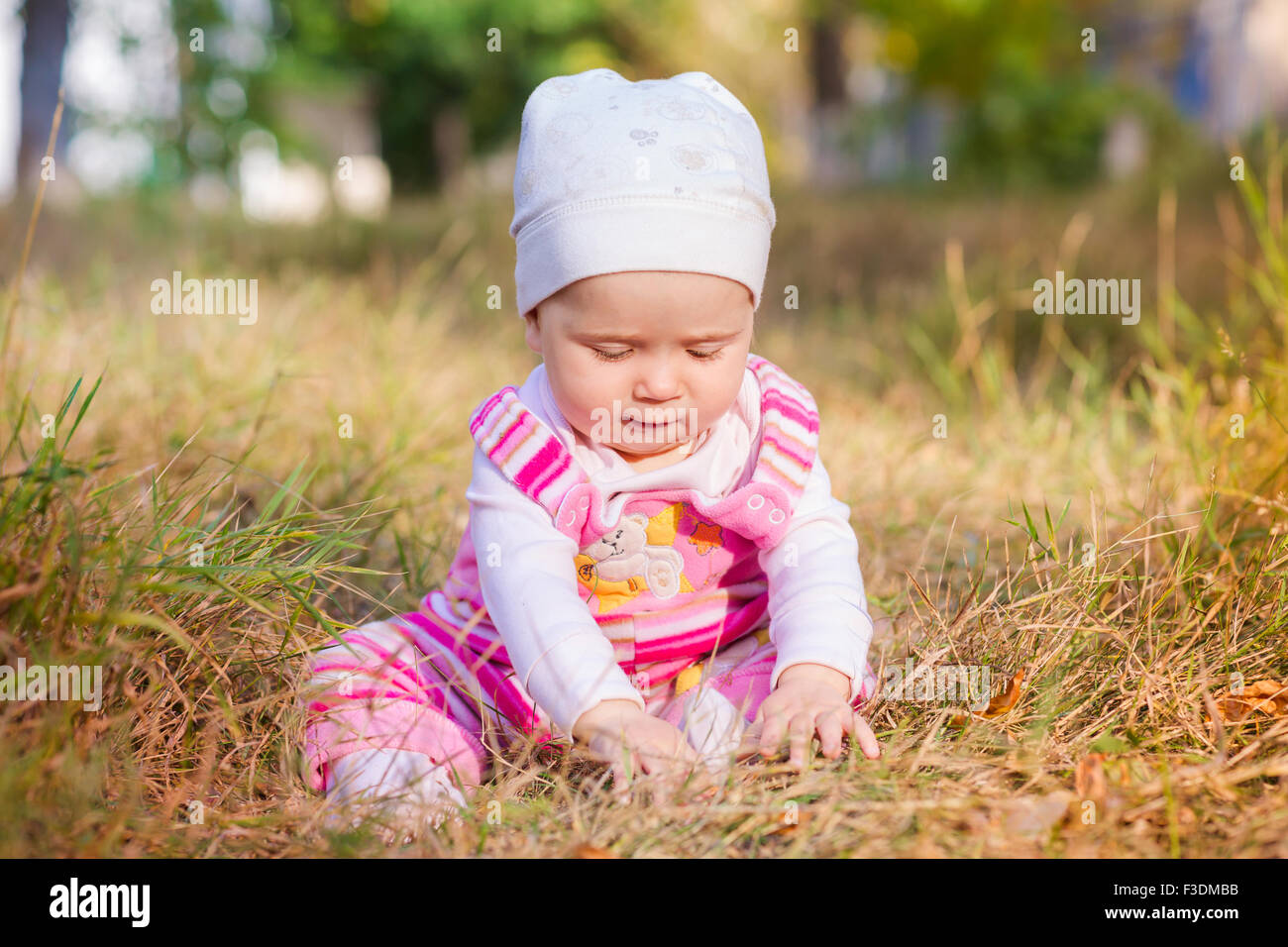 Cute baby in autumn leaves. First autumn Stock Photo - Alamy