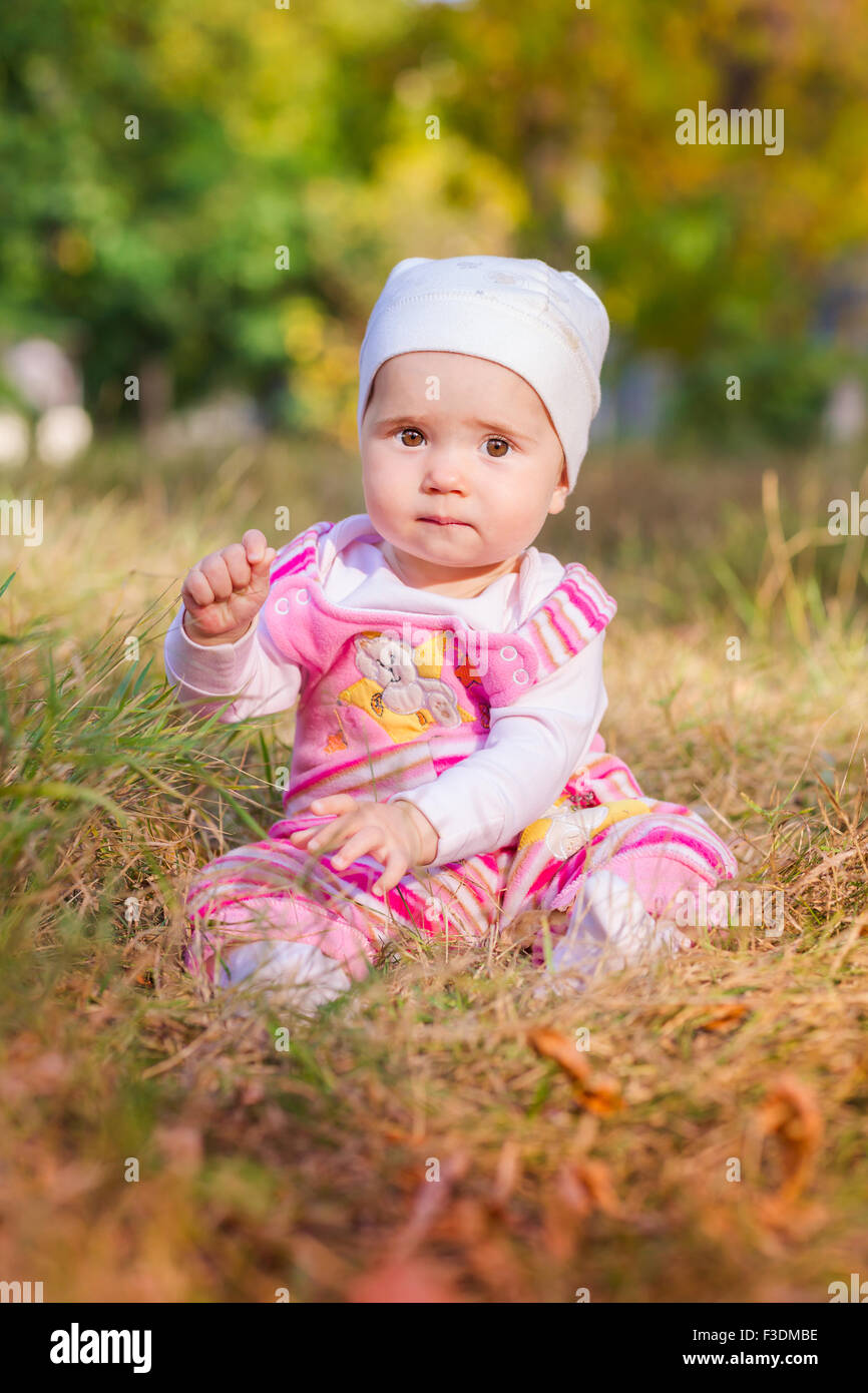 Cute baby in autumn leaves. First autumn Stock Photo - Alamy