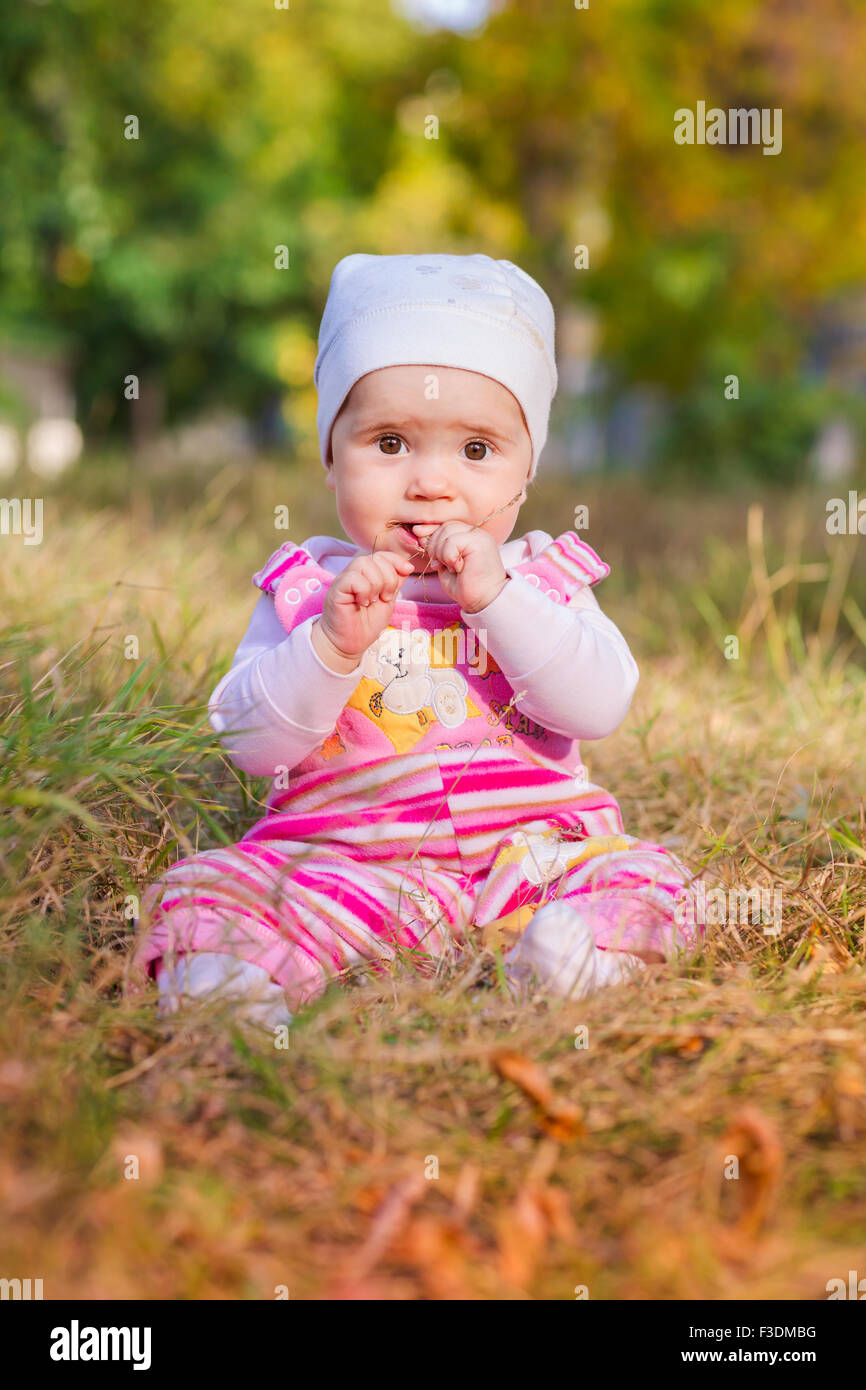 Cute baby in autumn leaves. First autumn Stock Photo - Alamy