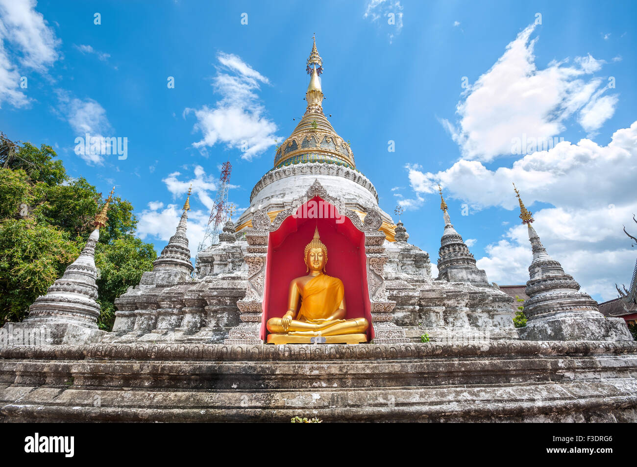 White chedi and golden Buddha statue at Wat Buppharam, Chiang Mai Stock ...