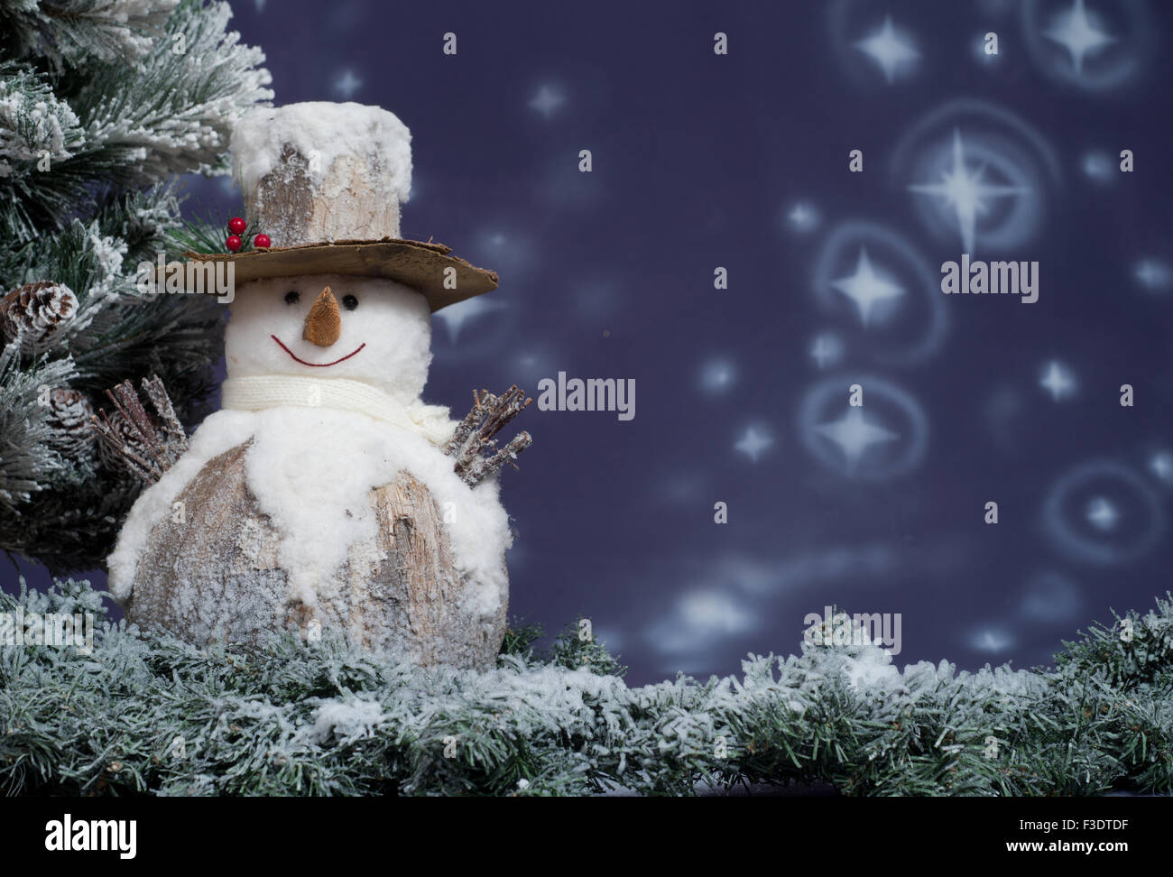 Snowman next to Christmas tree Stock Photo - Alamy