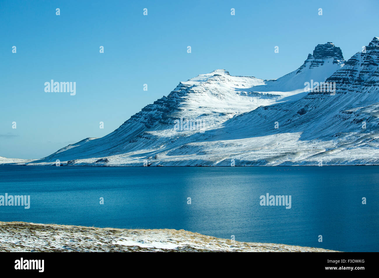 Snow-covered volcanic mountain landscape in Iceland Stock Photo - Alamy
